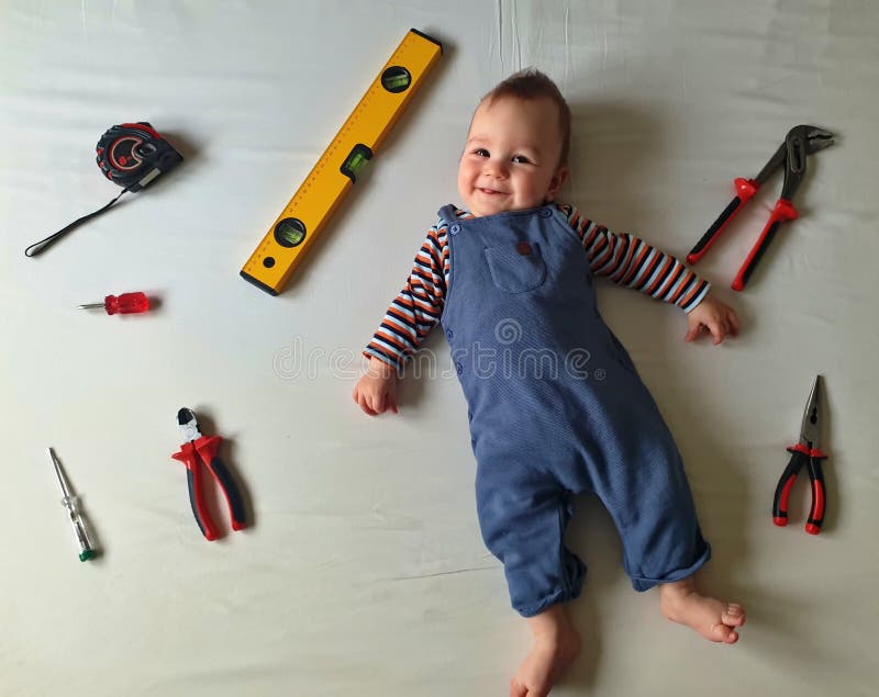 Baby with mechanic tools stock photo. Image of equipment - 256642620
