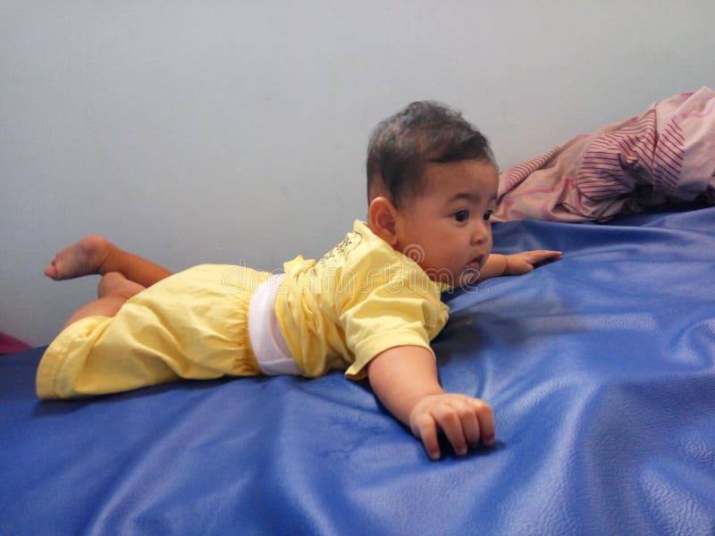 Baby editorial stock image. Image of months, baby, yellow - 66561119