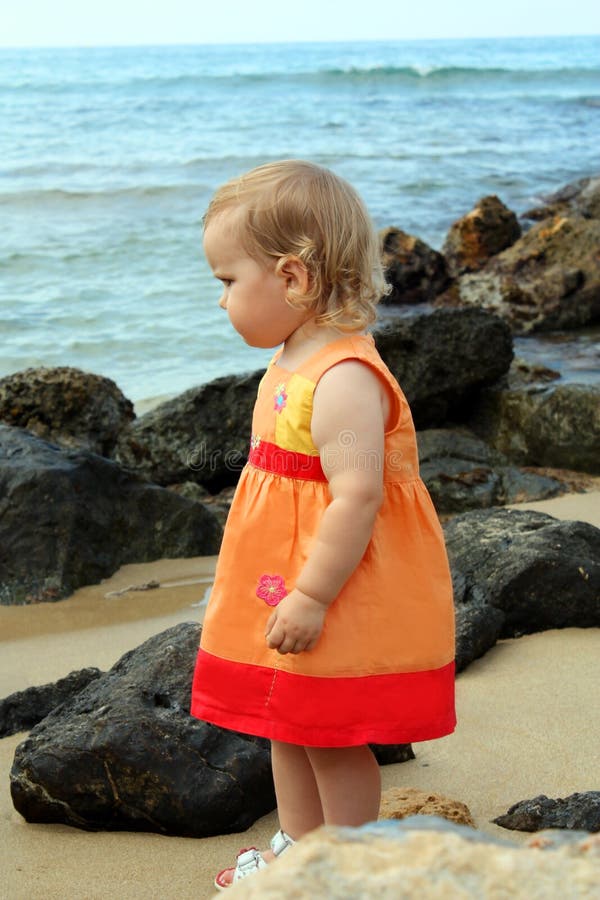 Baby near the sea stock photo. Image of coastline, sand - 11029512