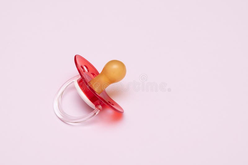 Baby New Red Pacifier on Pink Background Stock Photo - Image of ...