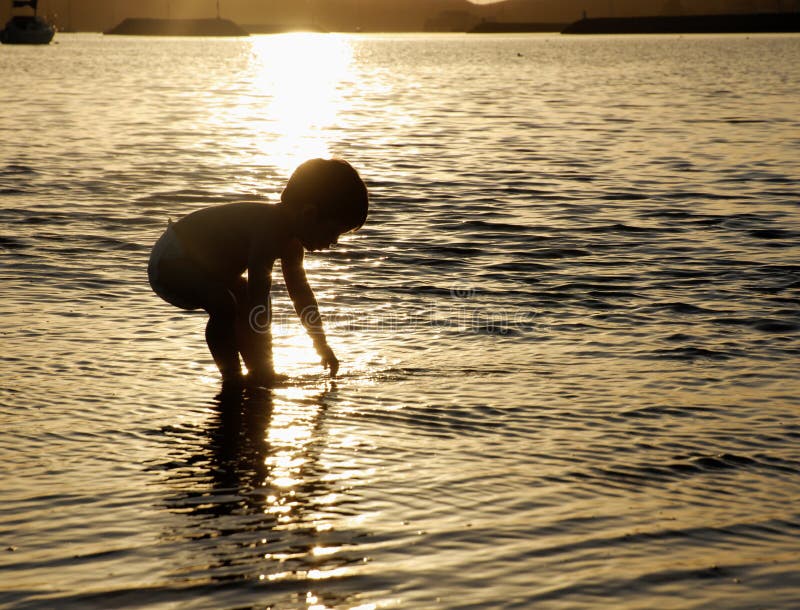 Baby in the Ocean stock image. Image of beach, ocean - 21484391