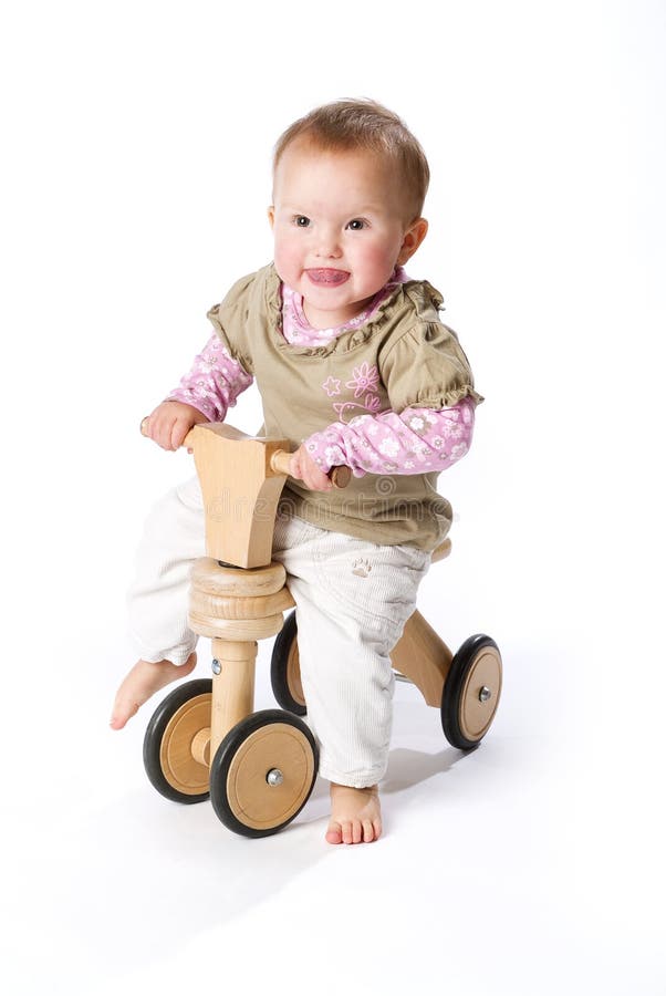 Baby op fiets stock foto. Image of zuigeling, achtergrond - 7063756