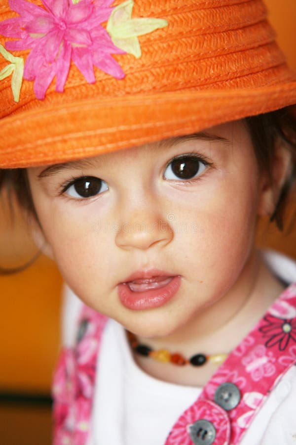 Baby with orange hat stock image. Image of beautiful - 12075981