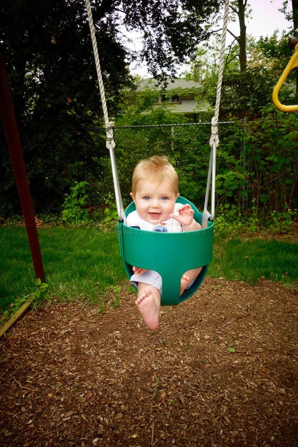 Baby outside on swing stock photo. Image of amusement - 69107238