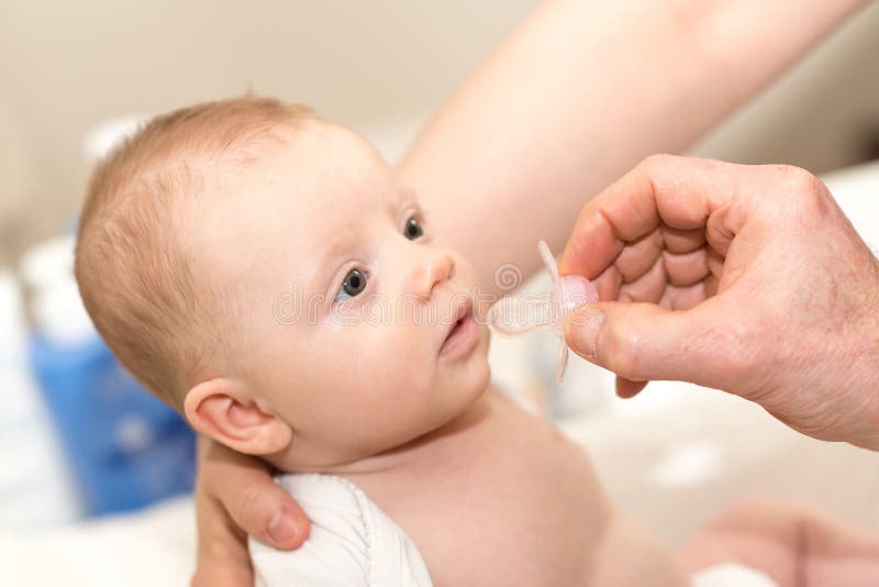 Baby and pacifier stock image. Image of infant, looking - 120093811