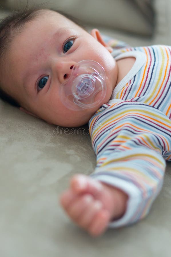 Baby with pacifier stock image. Image of infant, resting - 40148599