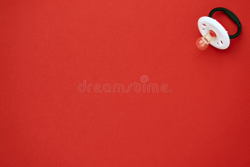 Baby Pacifier on a Red Background with Copy Space Stock Photo - Image ...