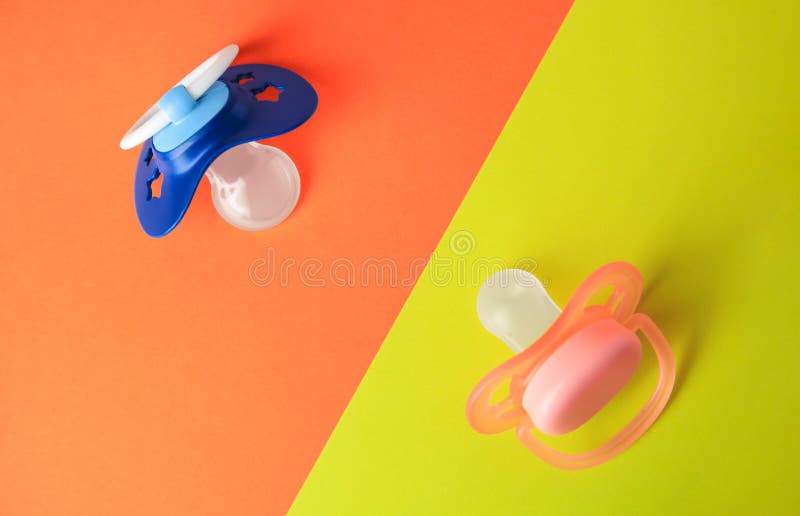Baby Pacifiers on Color Background, Flat Lay Stock Photo - Image of ...