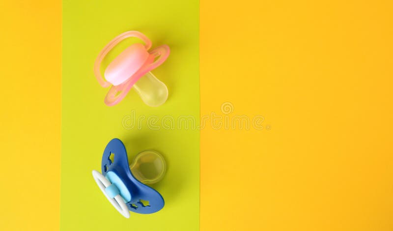 Baby Pacifiers on Color Background, Flat Lay. Space for Text Stock ...
