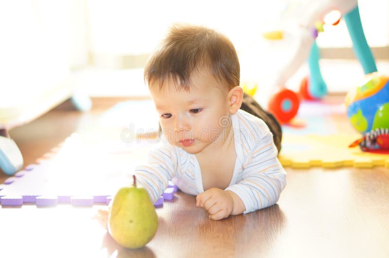 Baby and pear stock image. Image of pear, green, lying - 48787105