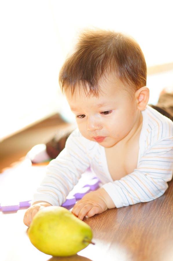 Baby and pear stock photo. Image of green, skin, toddler - 48787110