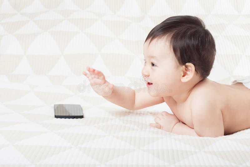 Baby and phone stock image. Image of childhood, lifestyles - 56954423