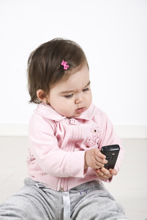 Baby with phone mobile stock image. Image of female, mobile - 14064627