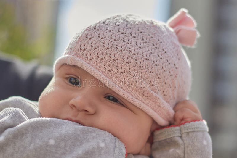 A Baby in a Pink Cap with Black Eyes Stock Image - Image of closeup ...