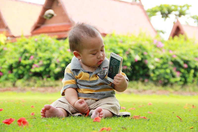 Baby play with phone stock image. Image of imagery, laughing - 42731755