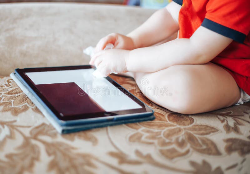 Baby play on tablet stock photo. Image of person, childhood - 114185294