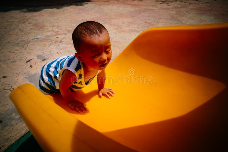 Baby on the Playground Slide Stock Image - Image of playground ...
