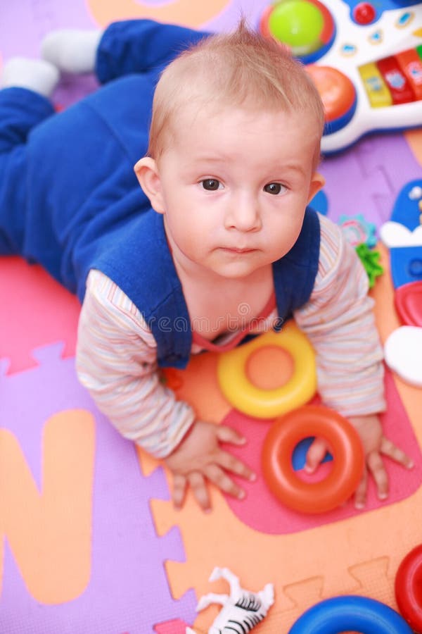 Baby playing with toys stock image. Image of families - 1899089