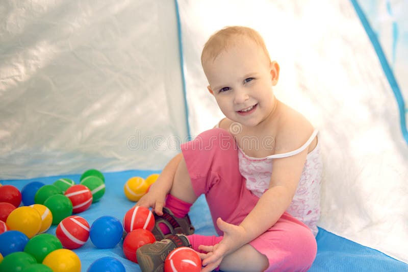 Baby playing with balls stock image. Image of beautiful - 32368705