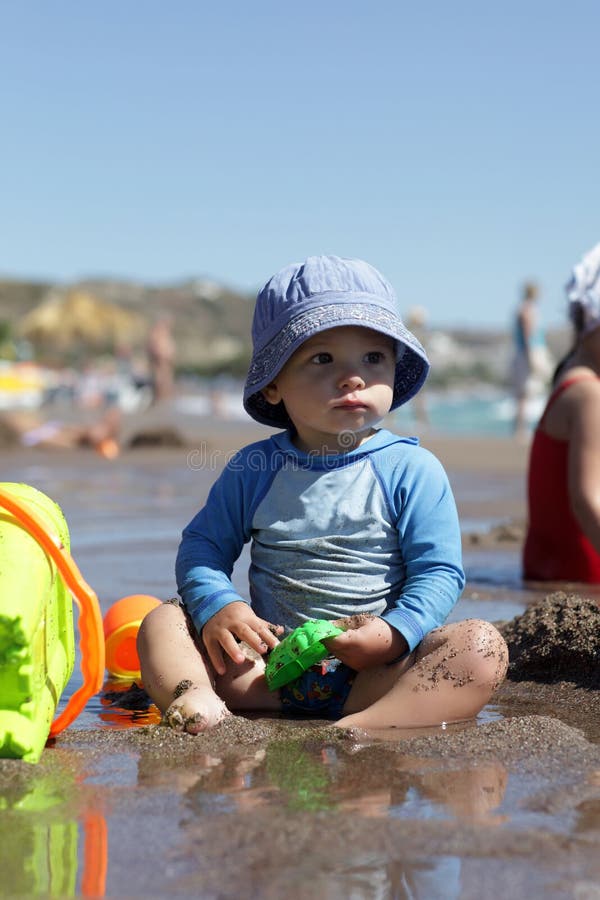 Baby playing on a beach stock image. Image of child, activity - 29624997