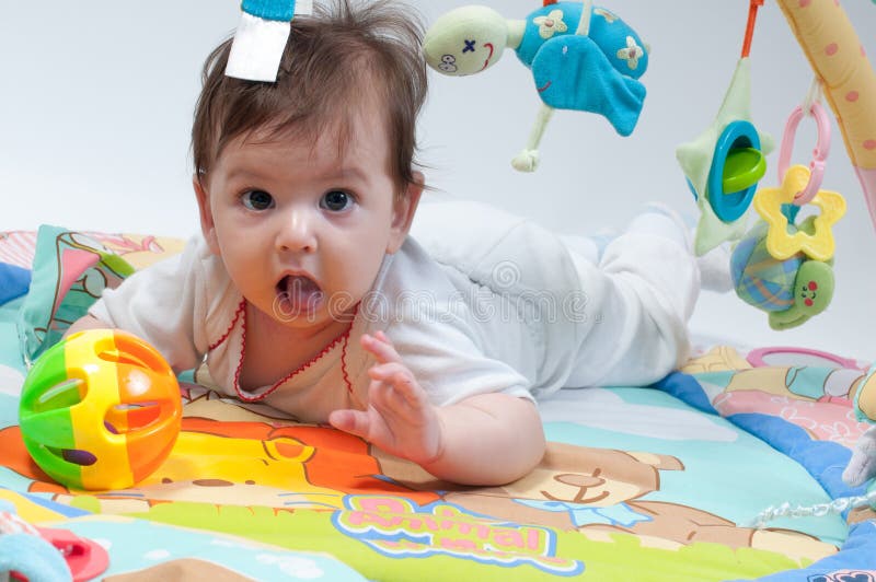 Baby playing in bed stock photo. Image of portrait, ingenuous - 43402876