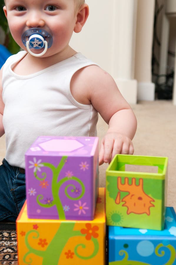 Baby playing with blocks stock image. Image of educate - 87470101