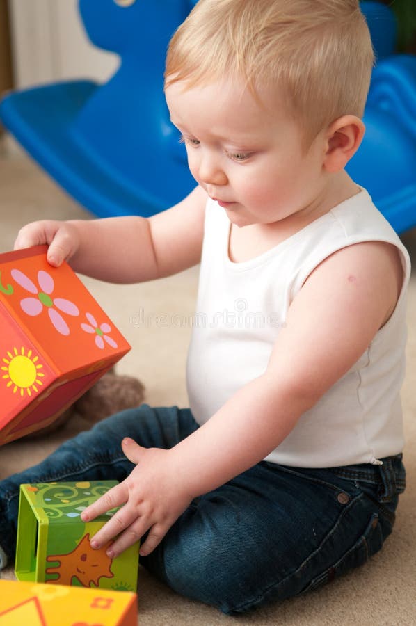 Baby playing with blocks stock photo. Image of learning - 87470296