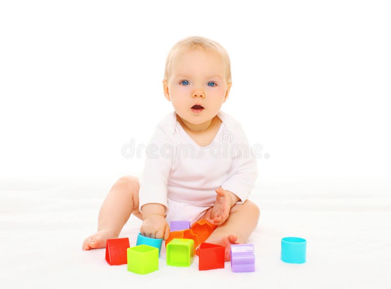 Baby Playing with Colorful Toys on White Background Stock Image - Image ...