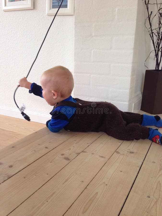 Baby Playing with cord editorial stock photo. Image of baby - 44066378