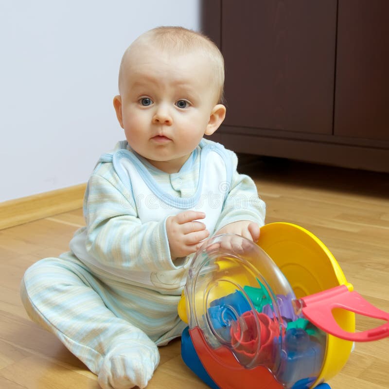 Baby Playing with Plastic Toy Stock Photo - Image of play, shape: 8299066