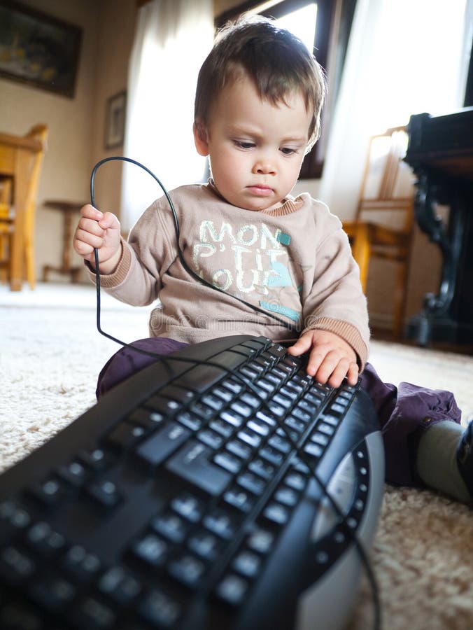Baby playing with keyboard stock image. Image of baby - 8368627