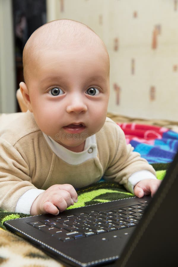 Baby Playing with the Laptop. Stock Image - Image of cute, face: 35356339