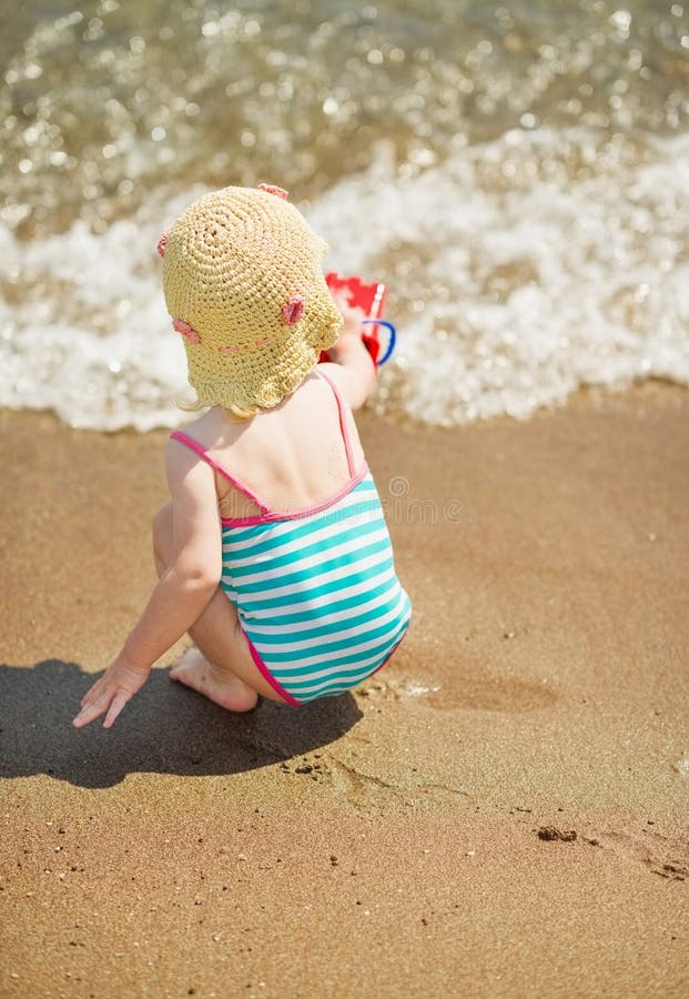Baby Playing Near Sea Rear View Stock Photos - Free & Royalty-Free ...