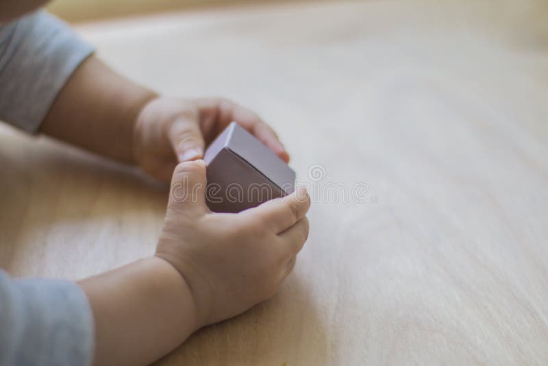 Baby Playing with Paper Cube Stock Image - Image of finger, nail: 134850569