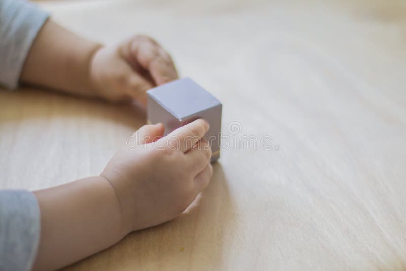 Baby Playing with Paper Cube Stock Photo - Image of playing, newborn ...