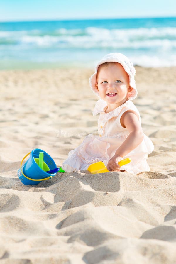 Baby playing at the sea stock photo. Image of blue, ocean - 55514624
