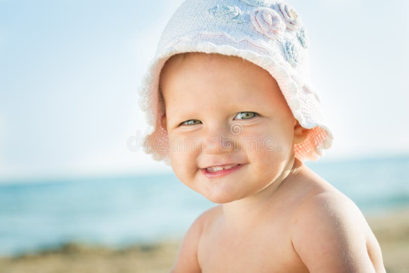 Baby playing at the sea stock image. Image of sand, cute - 55515295
