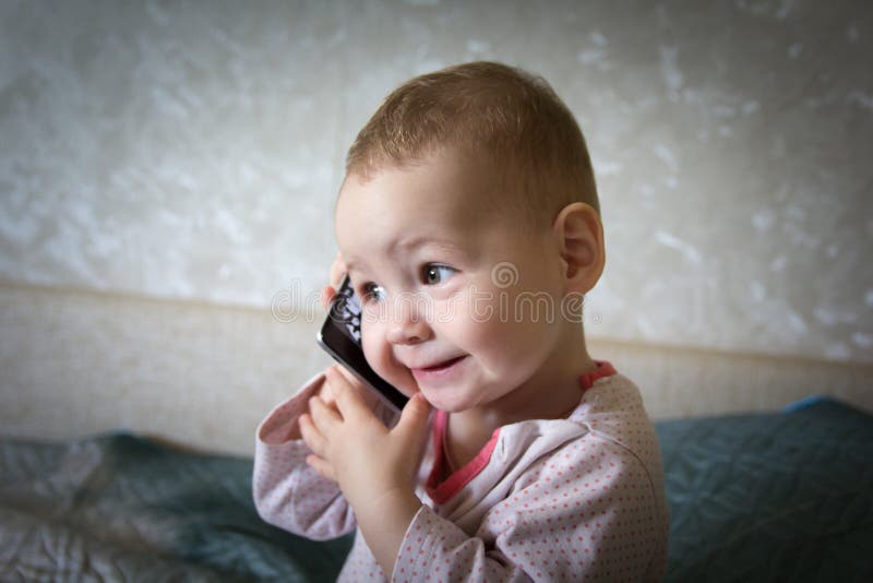 The Baby is Playing with a Smartphone Stock Image - Image of game, play ...