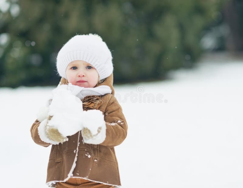 Baby Playing with Snow in Winter Park Stock Image - Image of ...