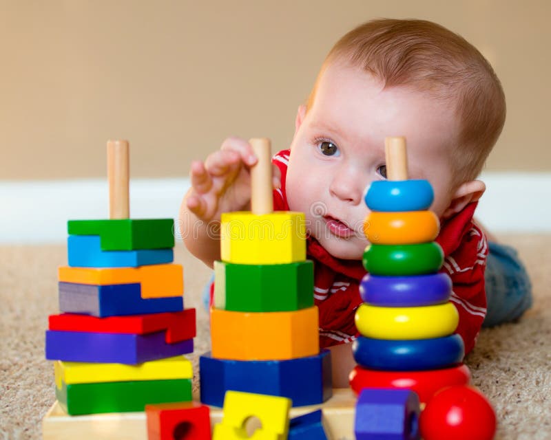 Baby Playing with Stacking Learning Toy Stock Photo - Image of ...
