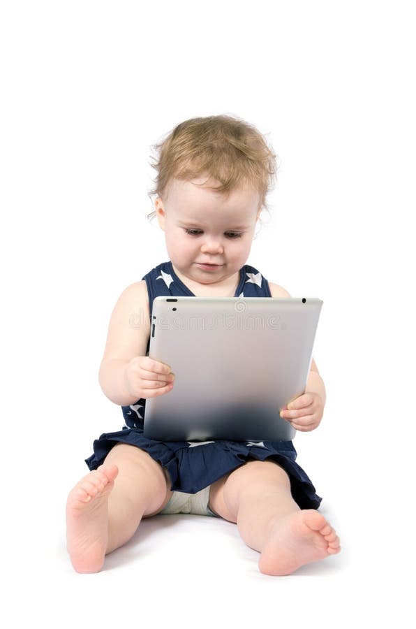 Baby playing with tablet stock photo. Image of looking - 24299302