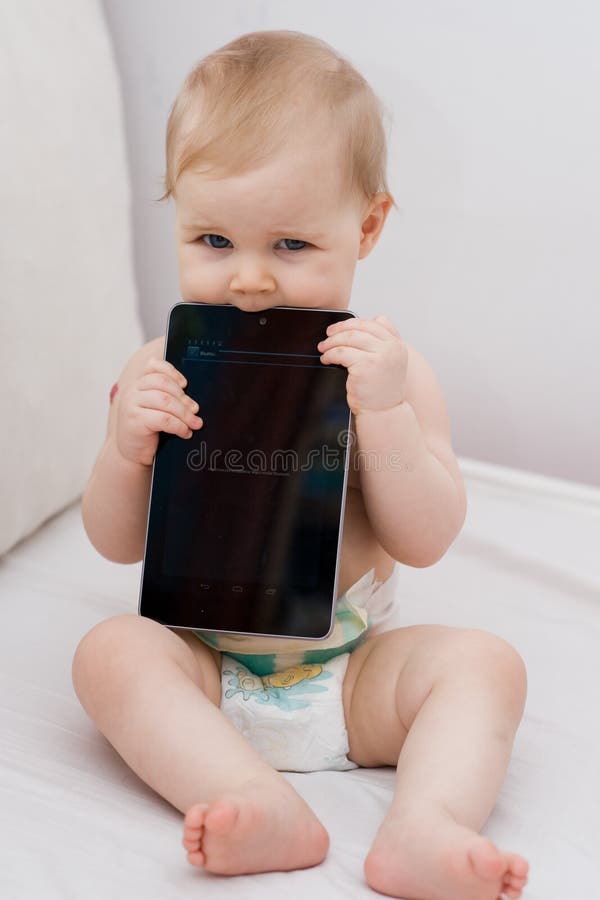 Baby playing with tablet stock photo. Image of tablet - 36981480