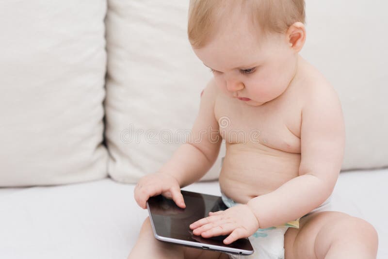 Baby playing with tablet stock photo. Image of small - 37196870