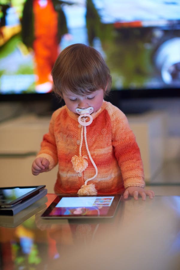Baby Playing with Tablet at Home Stock Photo - Image of holding ...