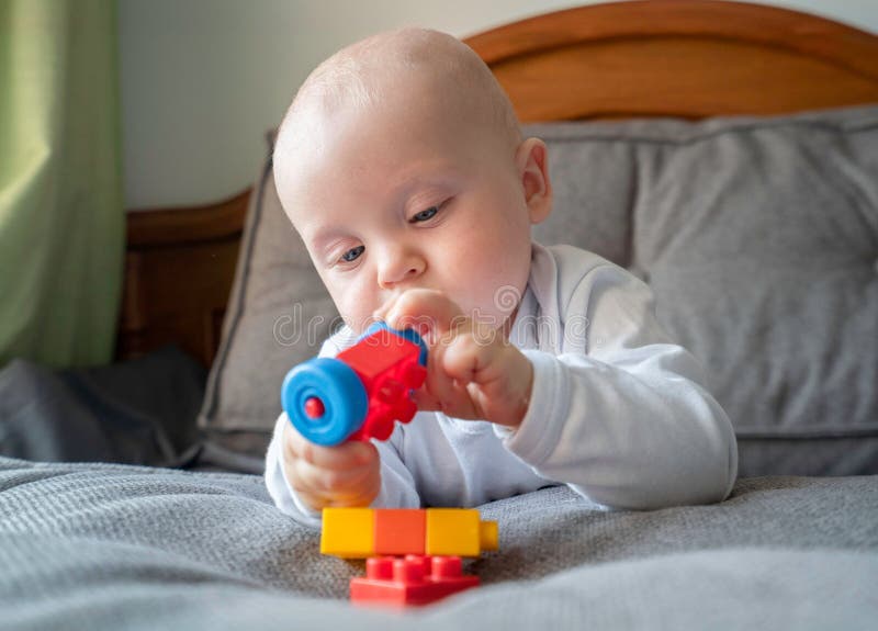 Baby is Playing with a Toy Train. Stock Image - Image of innocence ...