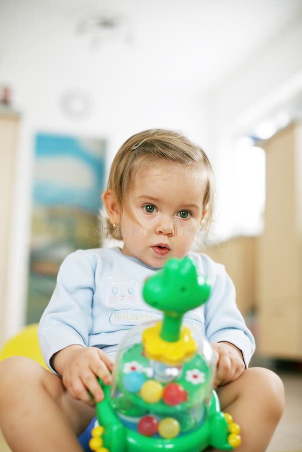 Baby playing with toys stock image. Image of families - 1899089