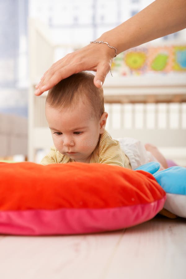 Baby on Playmat Concentrating Stock Photo - Image of baby, girls: 23609624