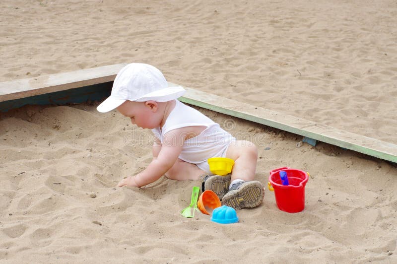 Baby Plays with Sand on Playground Stock Photo - Image of funny ...