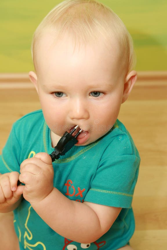 Baby with plug stock photo. Image of baby, child, power - 10606636