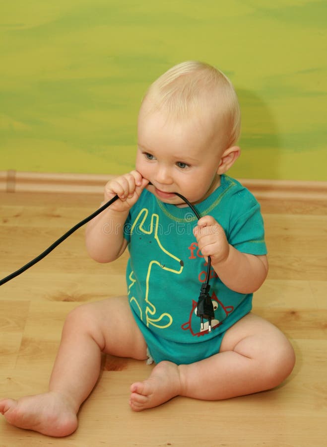 Baby with plug stock photo. Image of curiosity, boys - 10606654